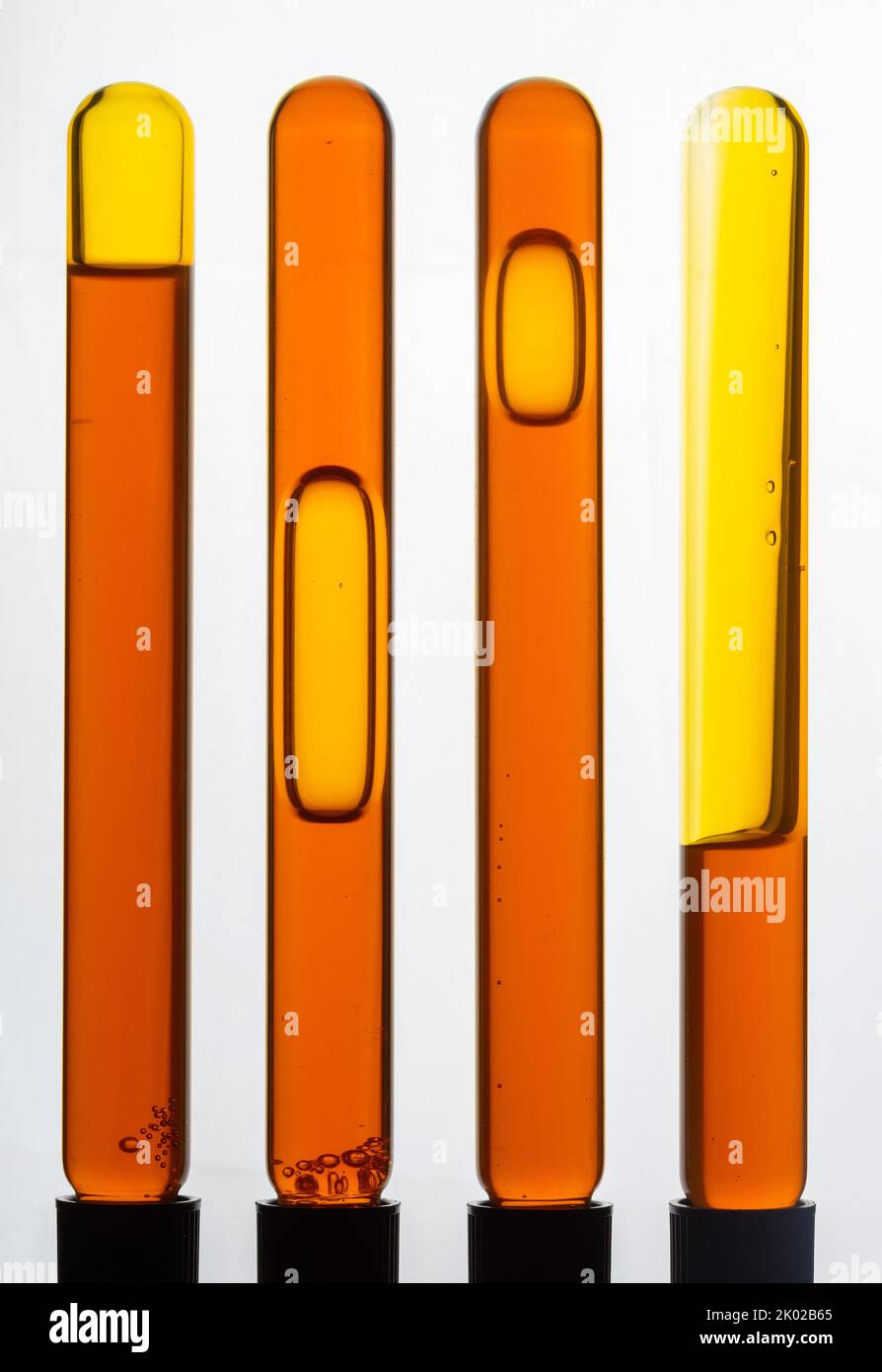 Yellow viscous liquid sunflower lecithin with bubbles in a transparent ...