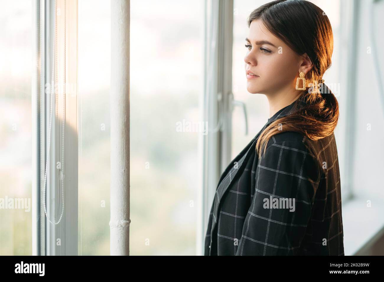 female leadership ambitious business woman window Stock Photo - Alamy