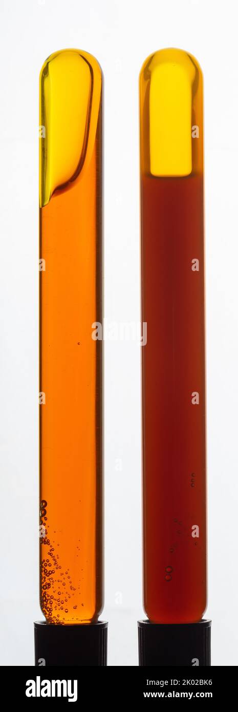 Yellow viscous liquid sunflower lecithin with bubbles in a transparent ...