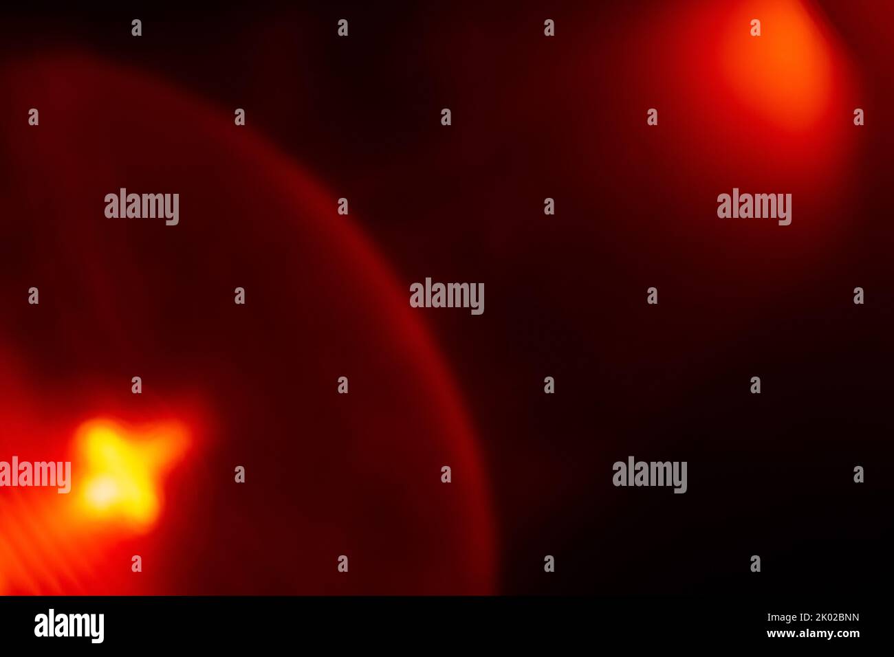 lens flare blur radiance light refraction red dark Stock Photo - Alamy