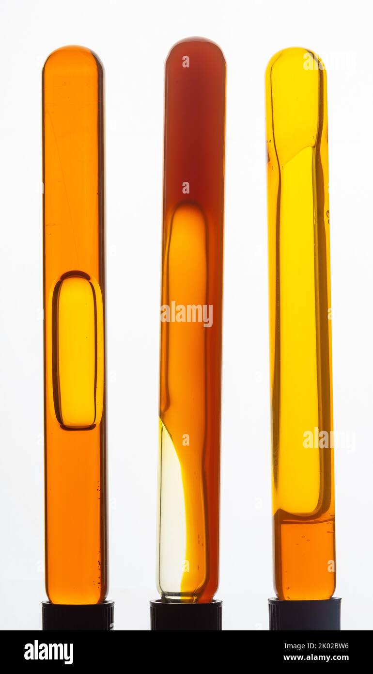 Yellow viscous liquid sunflower lecithin with bubbles in a transparent ...