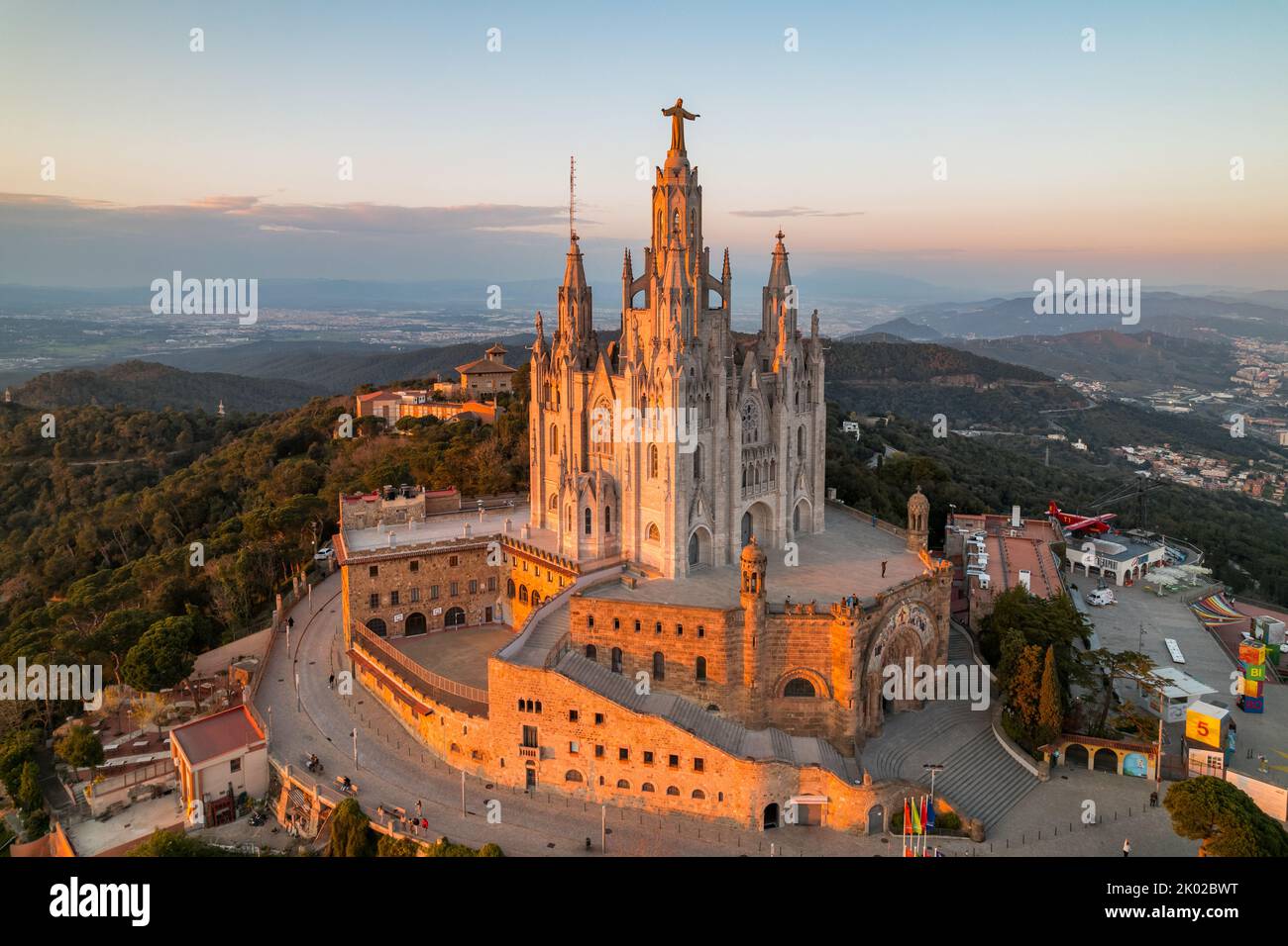 Aerial view of Barcelona skyline with Sagrat Cor temple during sunset ...