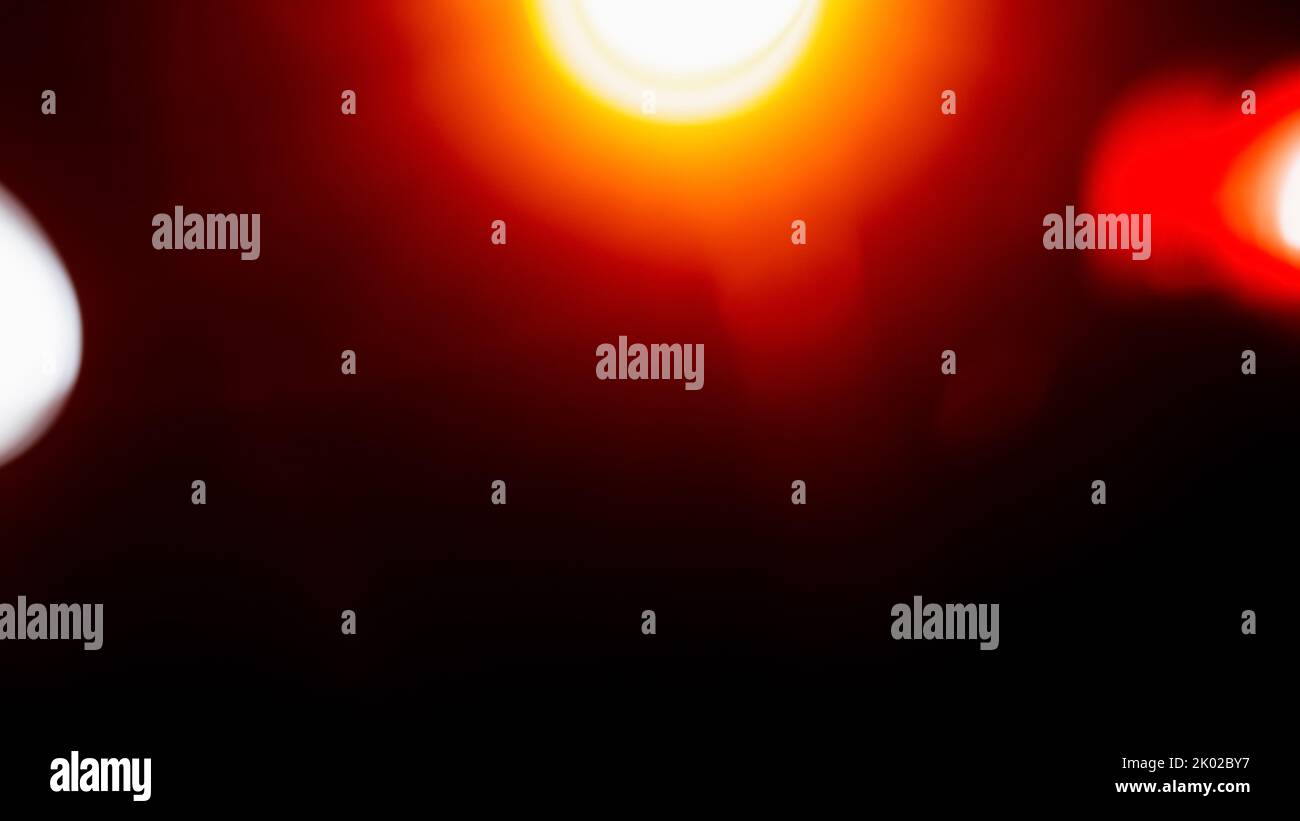 bokeh light defocused sun rays lens flare glow red Stock Photo - Alamy