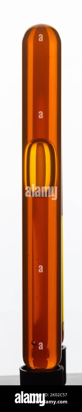 Yellow viscous liquid sunflower lecithin with bubbles in a transparent ...