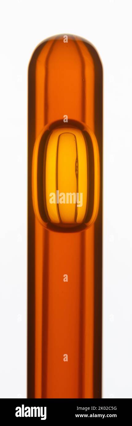 Yellow viscous liquid sunflower lecithin with bubbles in a transparent ...