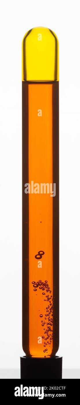 Yellow viscous liquid sunflower lecithin with bubbles in a transparent ...