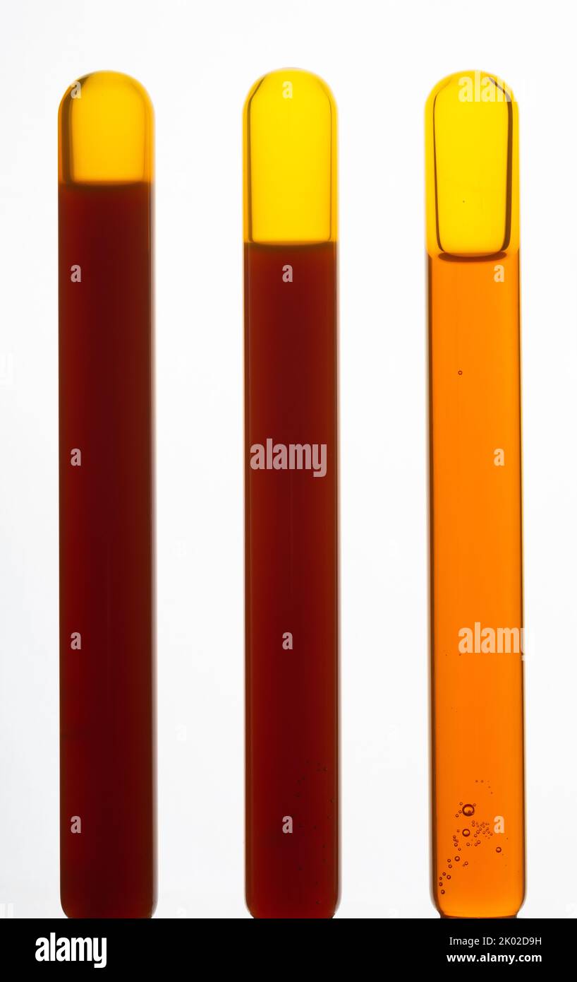 Yellow viscous liquid sunflower lecithin with bubbles in a transparent ...