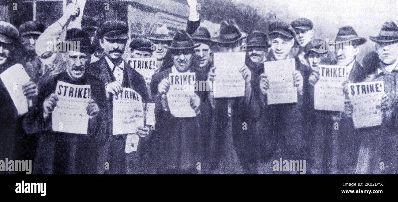 American metalworkers at the gates of the factory with posters calling ...