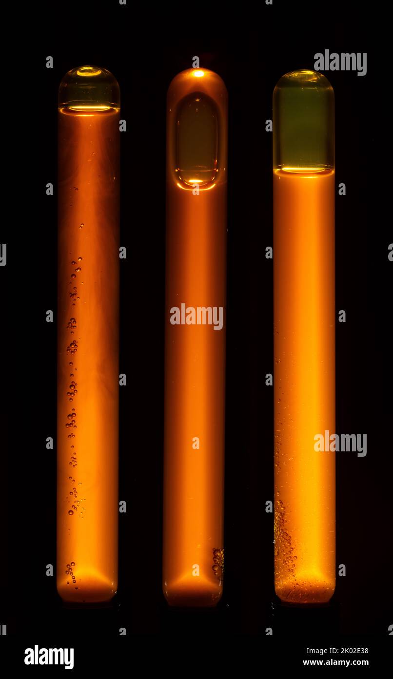 Yellow viscous liquid sunflower lecithin with bubbles in a transparent ...