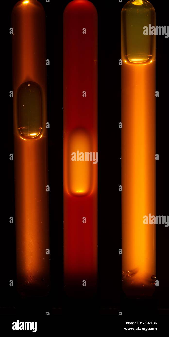 Yellow viscous liquid sunflower lecithin with bubbles in a transparent ...