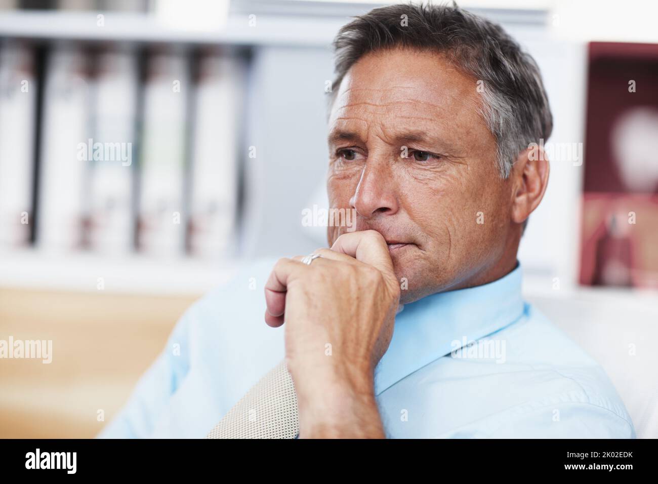 Serious entrepreneur looking solutions sitting hi-res stock photography ...
