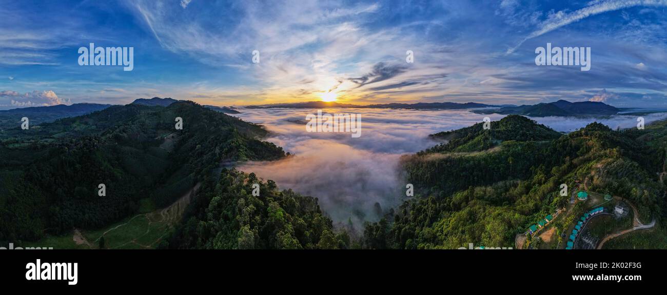 Aerial view Panorama of flowing fog waves on mountain tropical ...