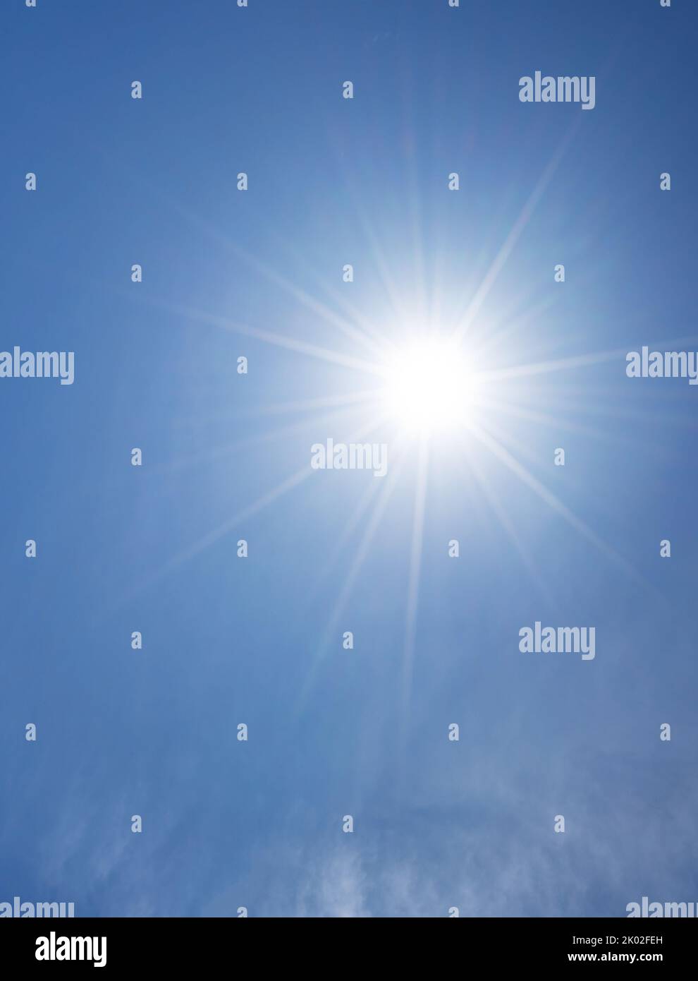 Shining sun on clear blue sky with lens flare of sunlight on sky ...