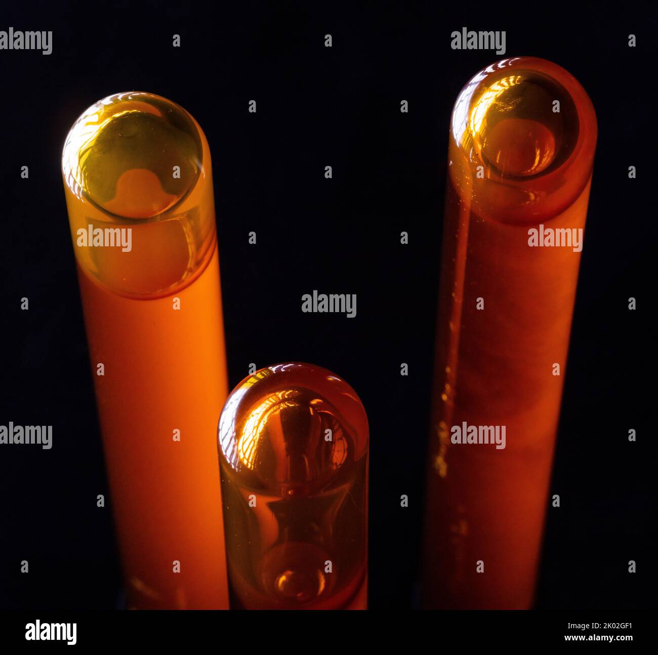 Yellow viscous liquid sunflower lecithin with bubbles in a transparent ...