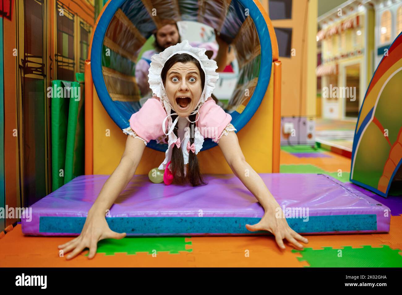 Funny screaming woman like baby in maze Stock Photo - Alamy
