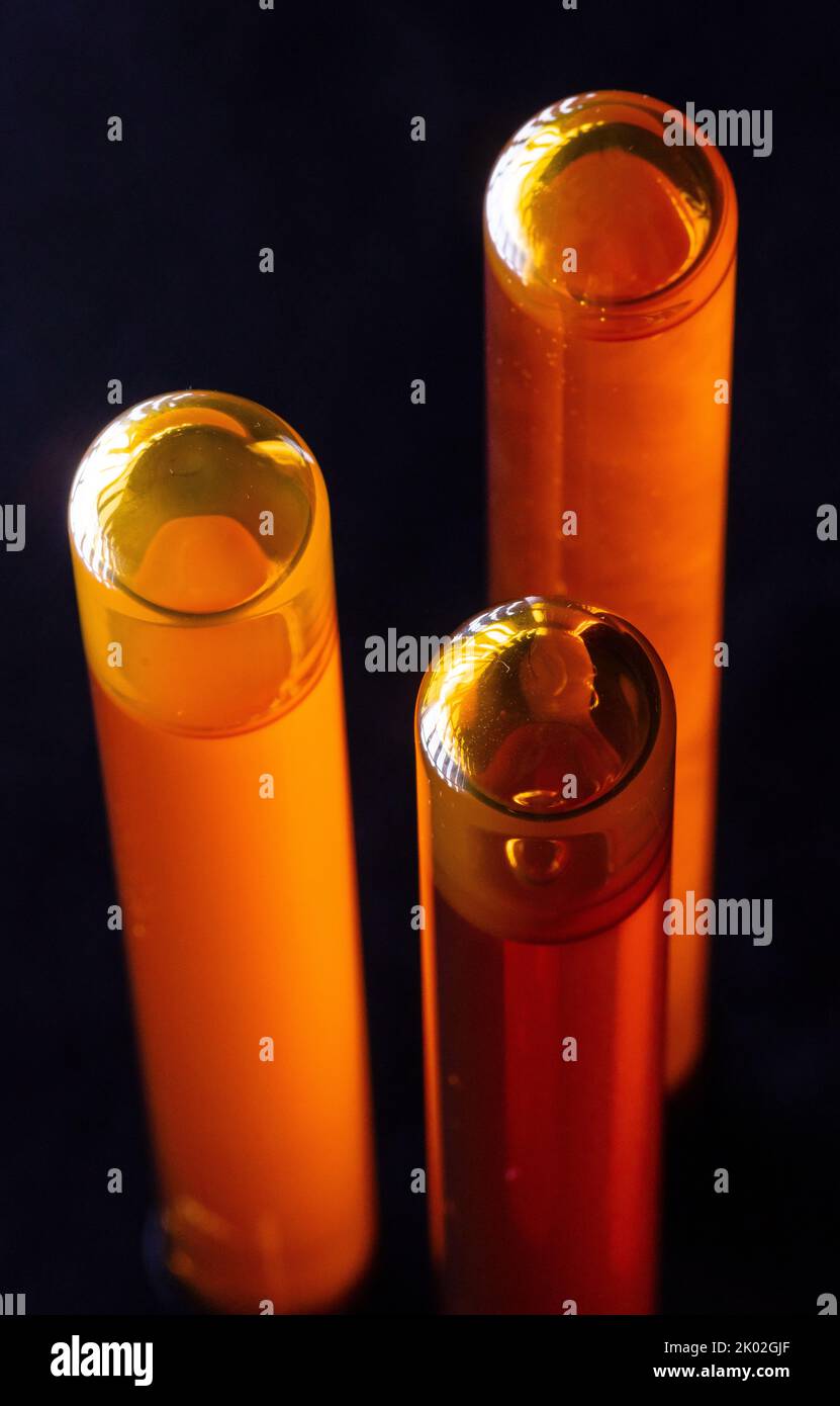 Yellow viscous liquid sunflower lecithin with bubbles in a transparent ...