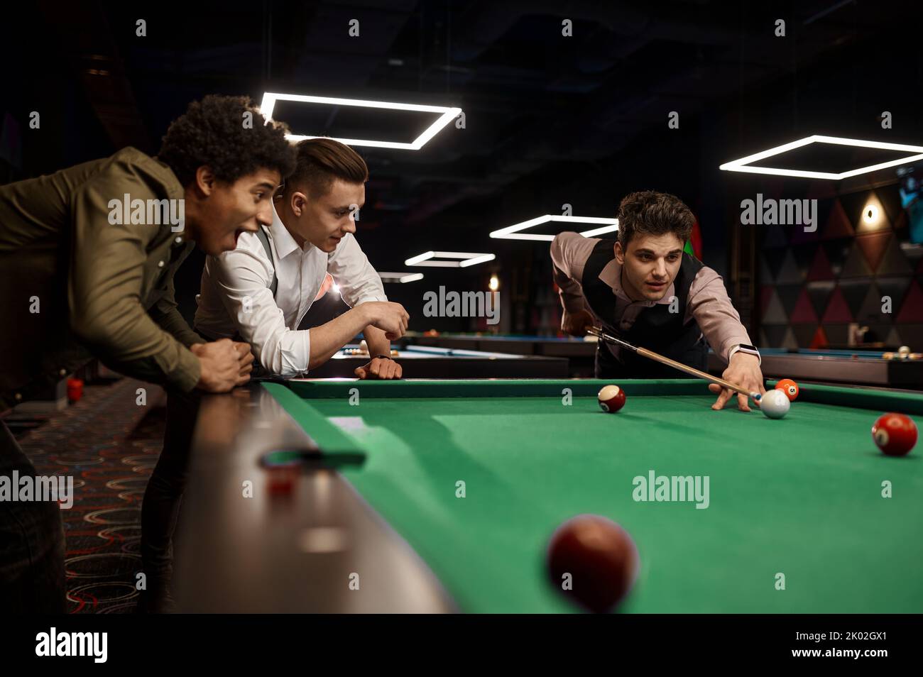 Group friends playing billiards hi-res stock photography and images - Alamy