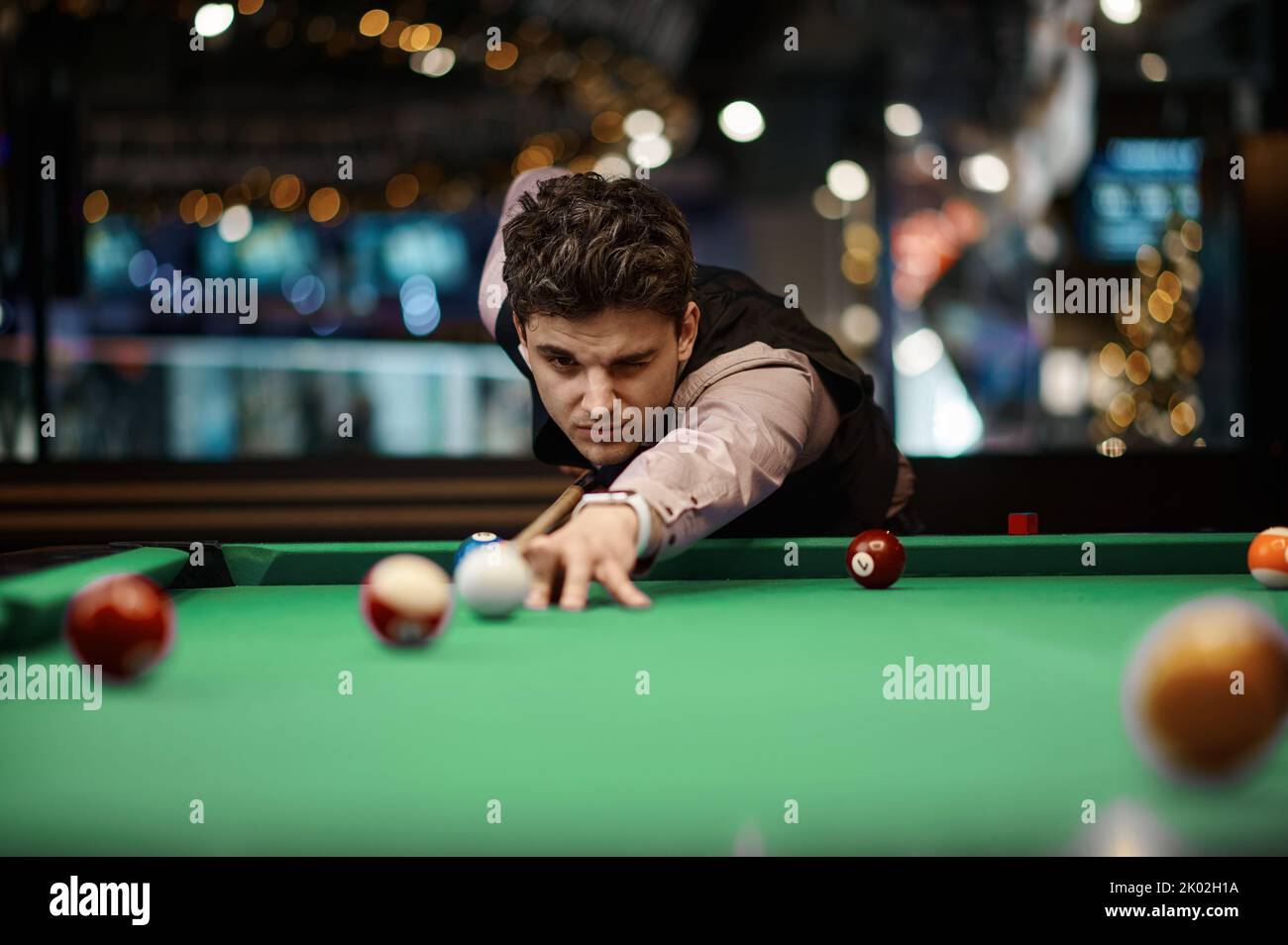 Portrait of man playing billiard Stock Photo - Alamy