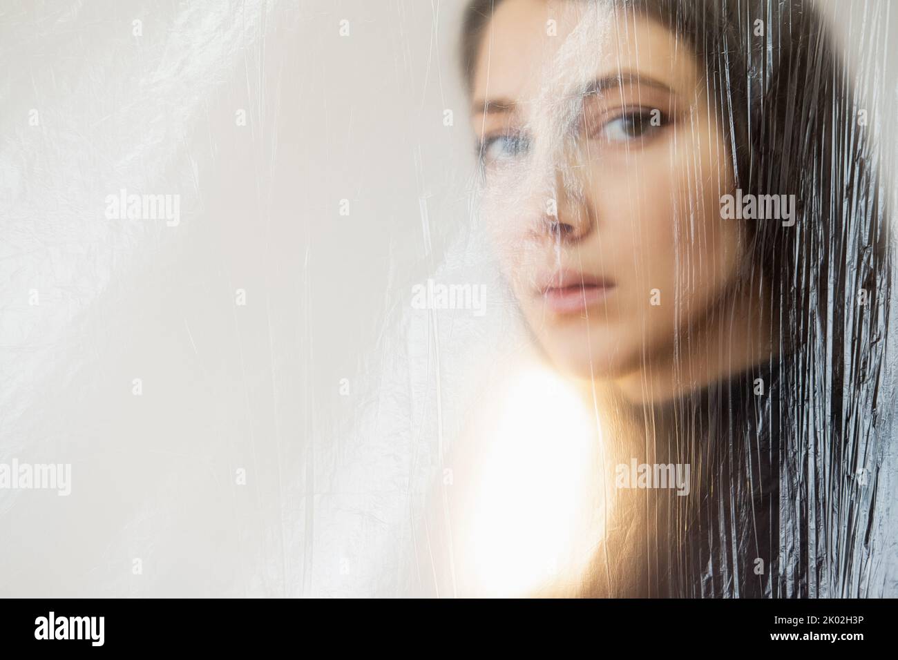 defocused female portrait lost depression social Stock Photo - Alamy