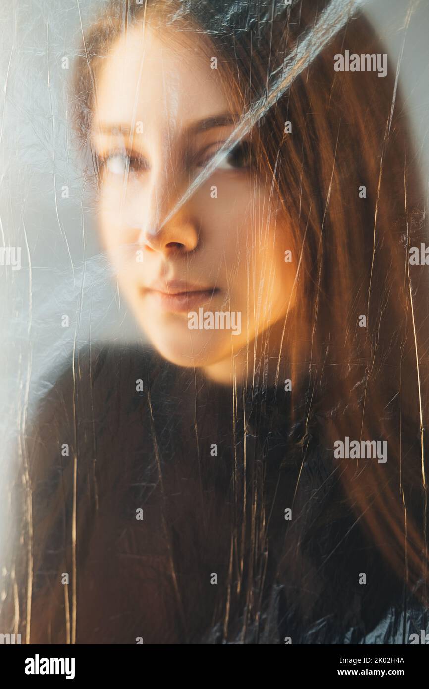 defocused female portrait social anxiety isolation Stock Photo - Alamy