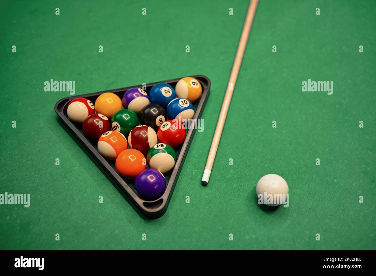 Billiard table with green surface and balls Stock Photo - Alamy