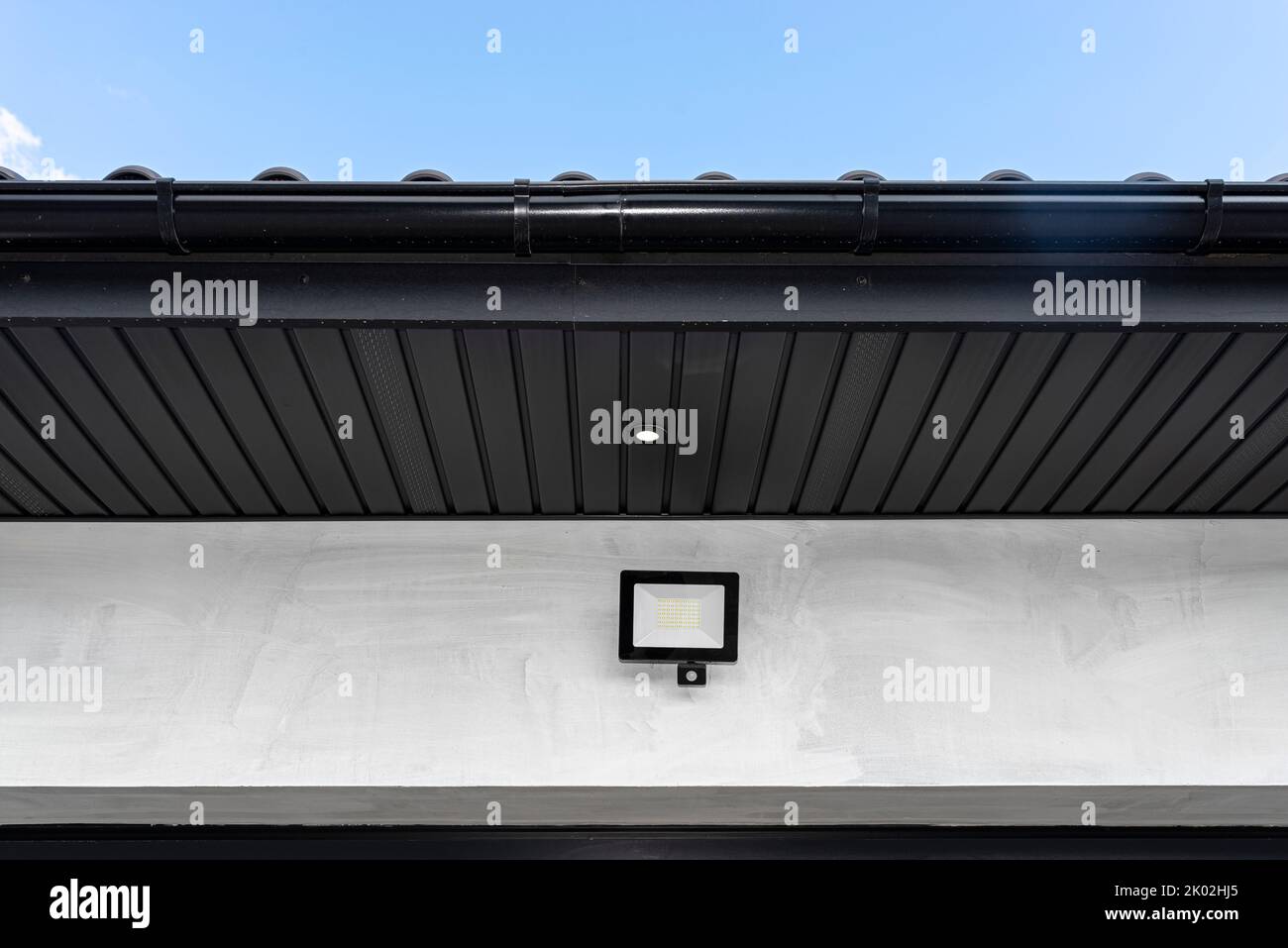 A modern graphite roof lining is attached to the trusses, visible ...