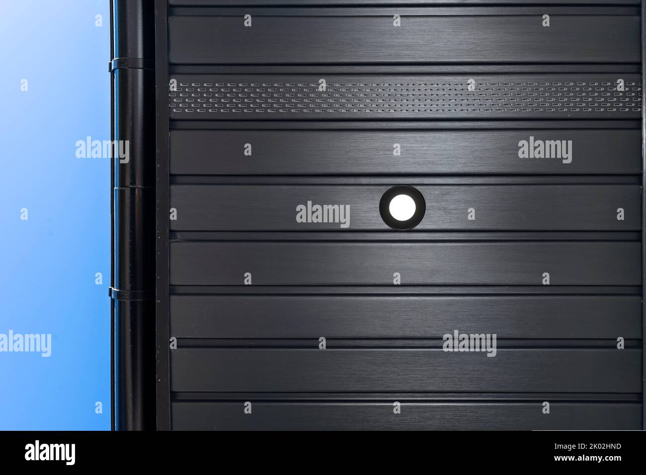 A modern graphite roof lining is attached to the trusses, visible ...