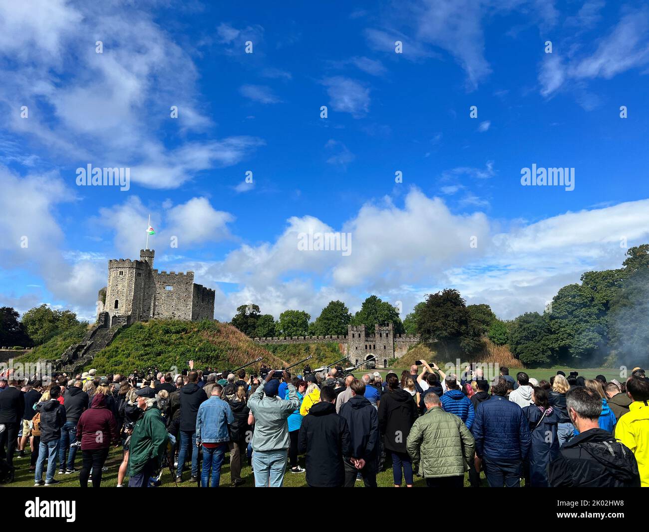 Spectators look on as soldiers fire a 96 gun salute at Cardiff Castle ...