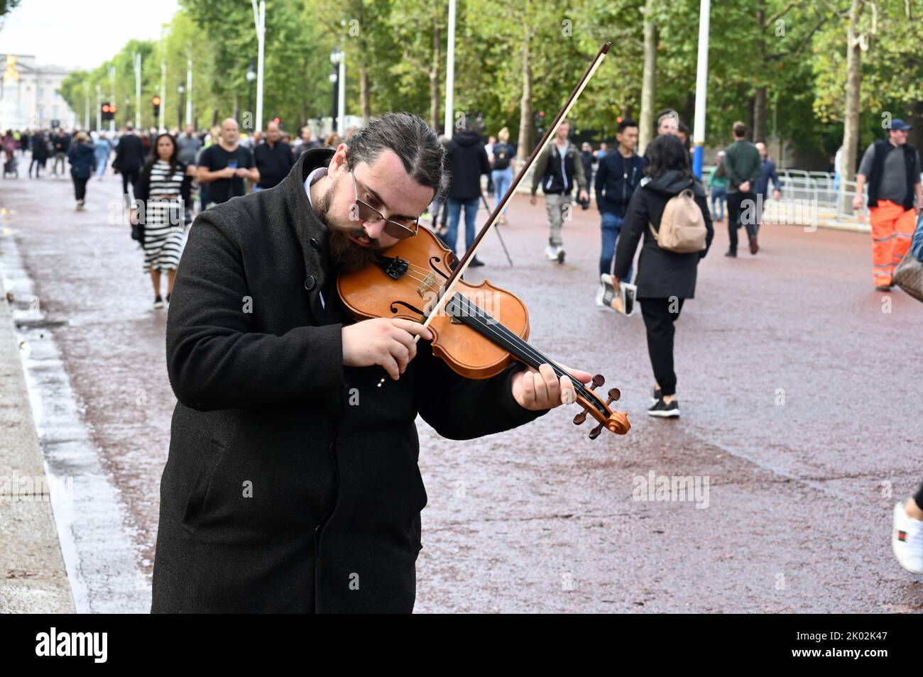 London, UK. Violinist Byron Horn played a sad lament to the crowds who ...