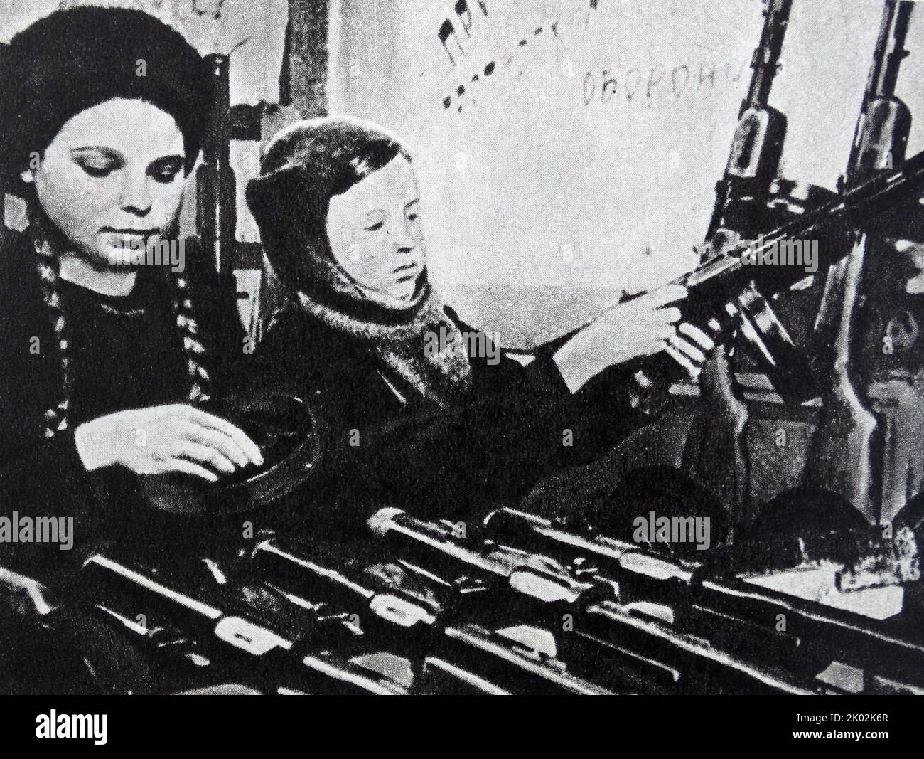 Soviet children assembling the weapons to support the troops during ...