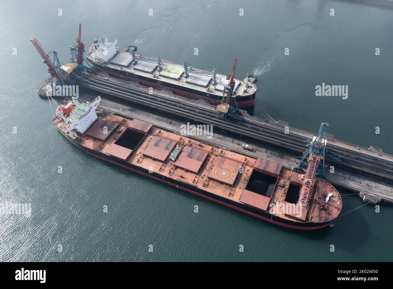 Nakhodka, Russia - July 31, 2022: The sea ships are loaded at a mooring ...