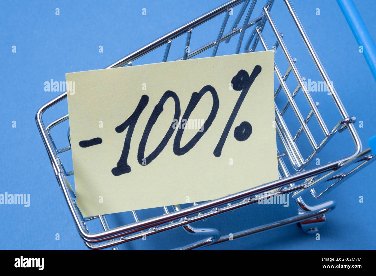Shopping basket with a banner that says minus 100 percent Stock Photo ...