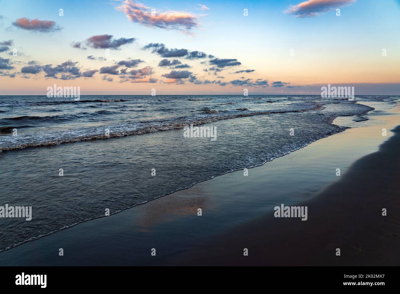 Empty beach after sunset time Stock Photo - Alamy