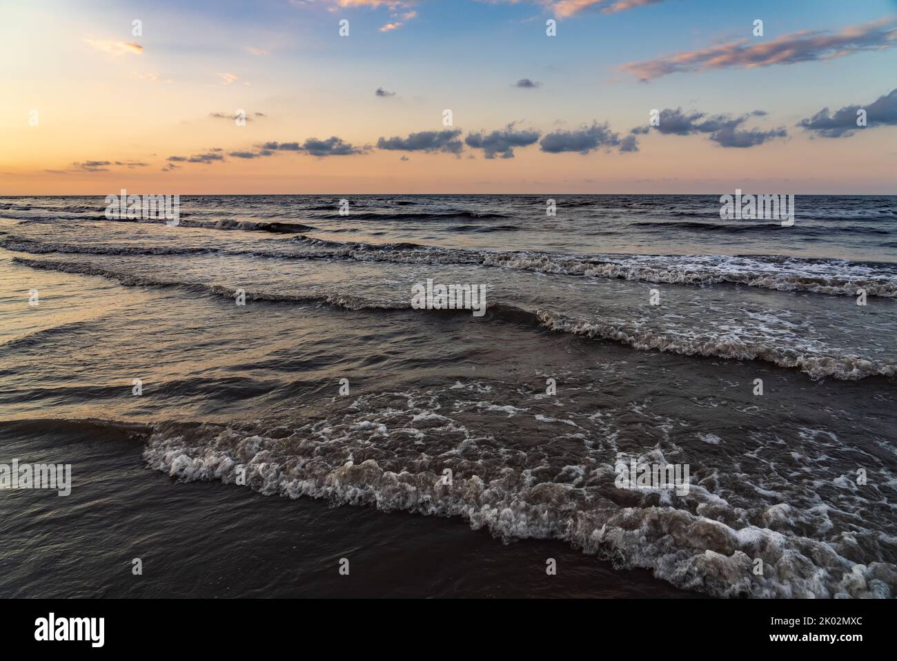 Empty beach at sunset hi-res stock photography and images - Alamy