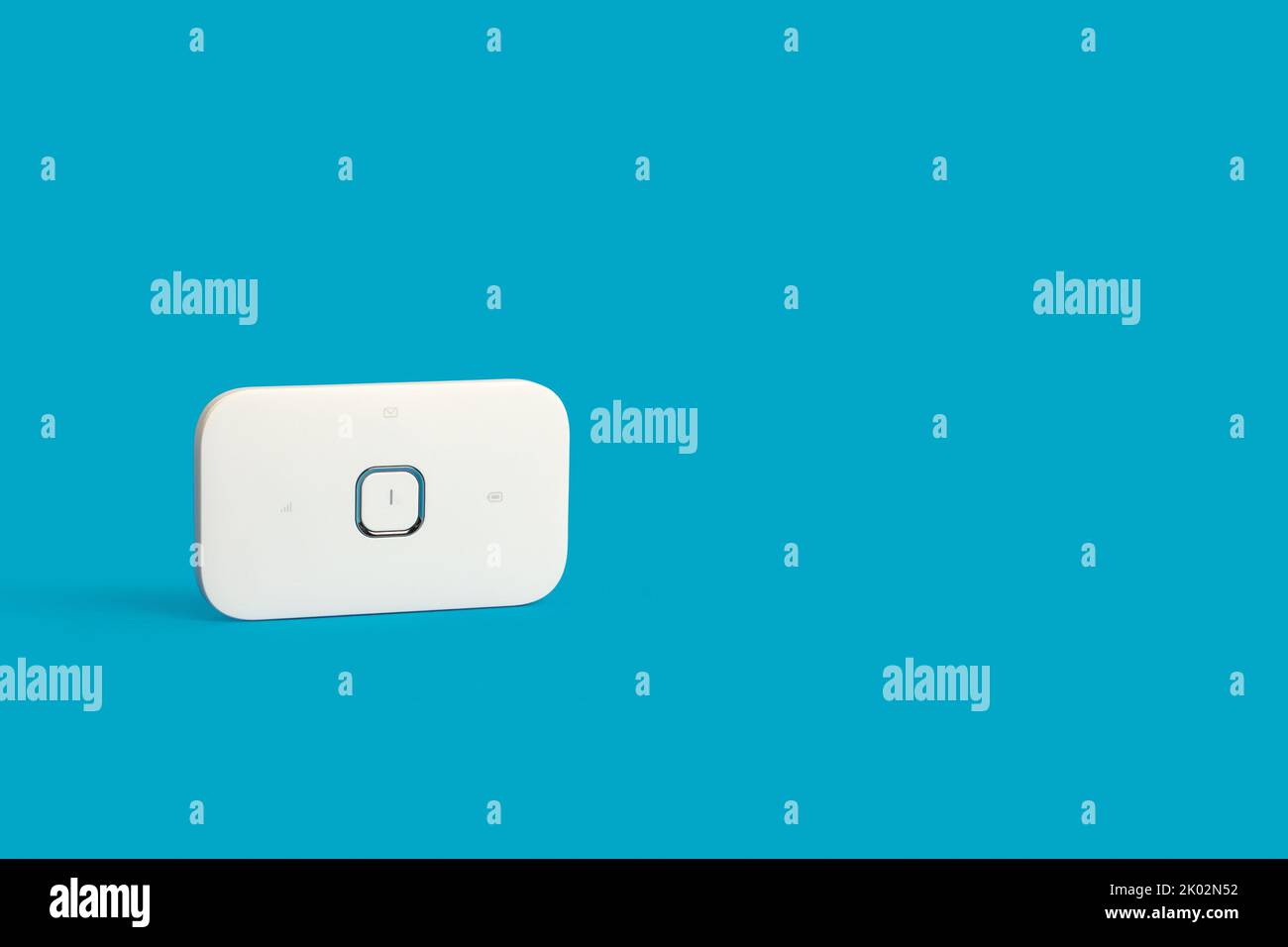 A compact modem device on a blue background with copy space Stock Photo ...