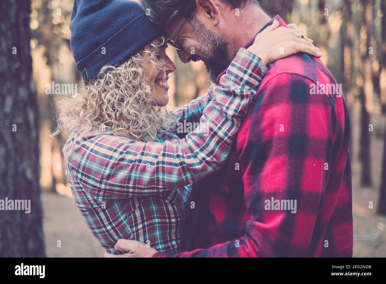 Love couple and outdoor nature romantic leisure activity together. Man and woman hugging and ...