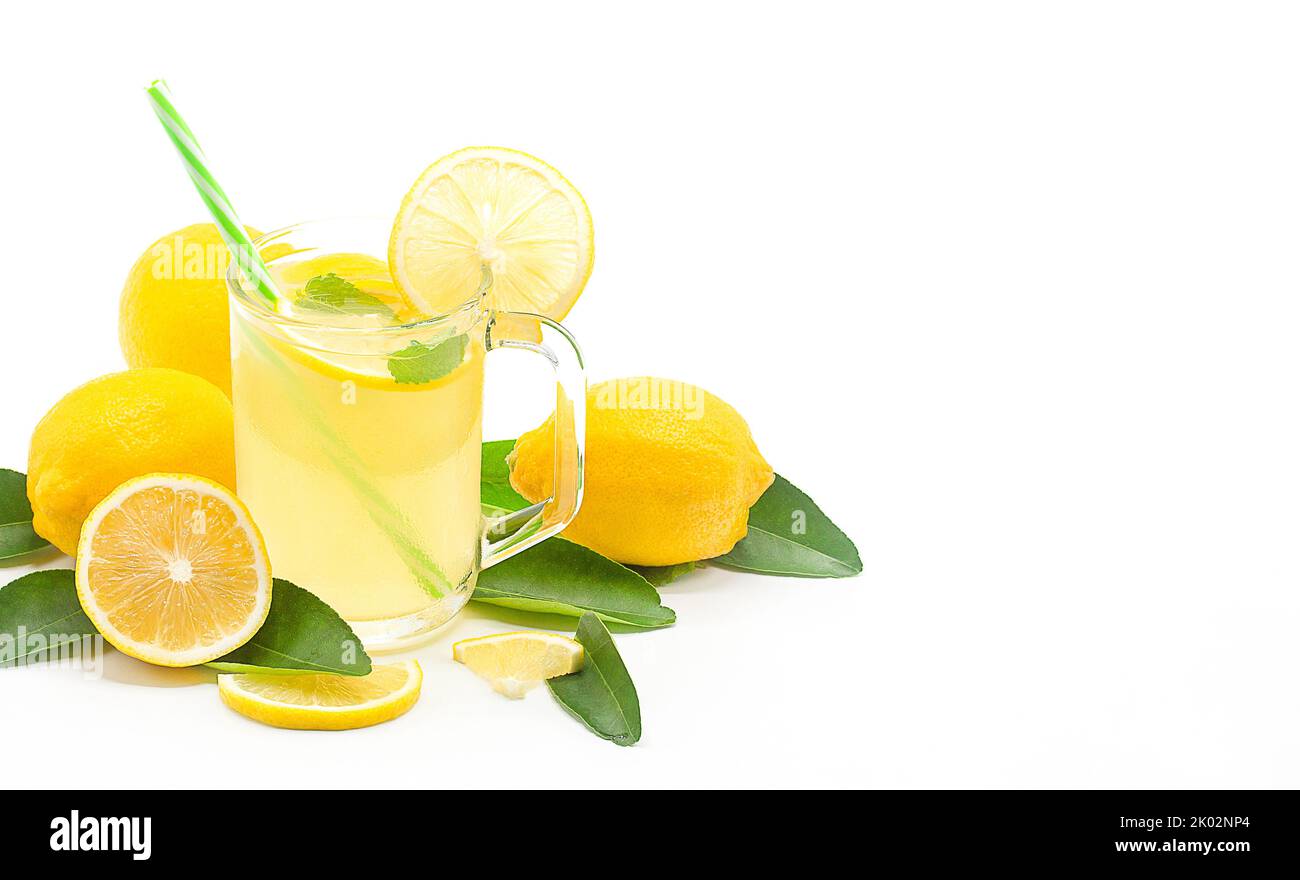 Lemon juice in a glass isolated on a white background with copy space ...