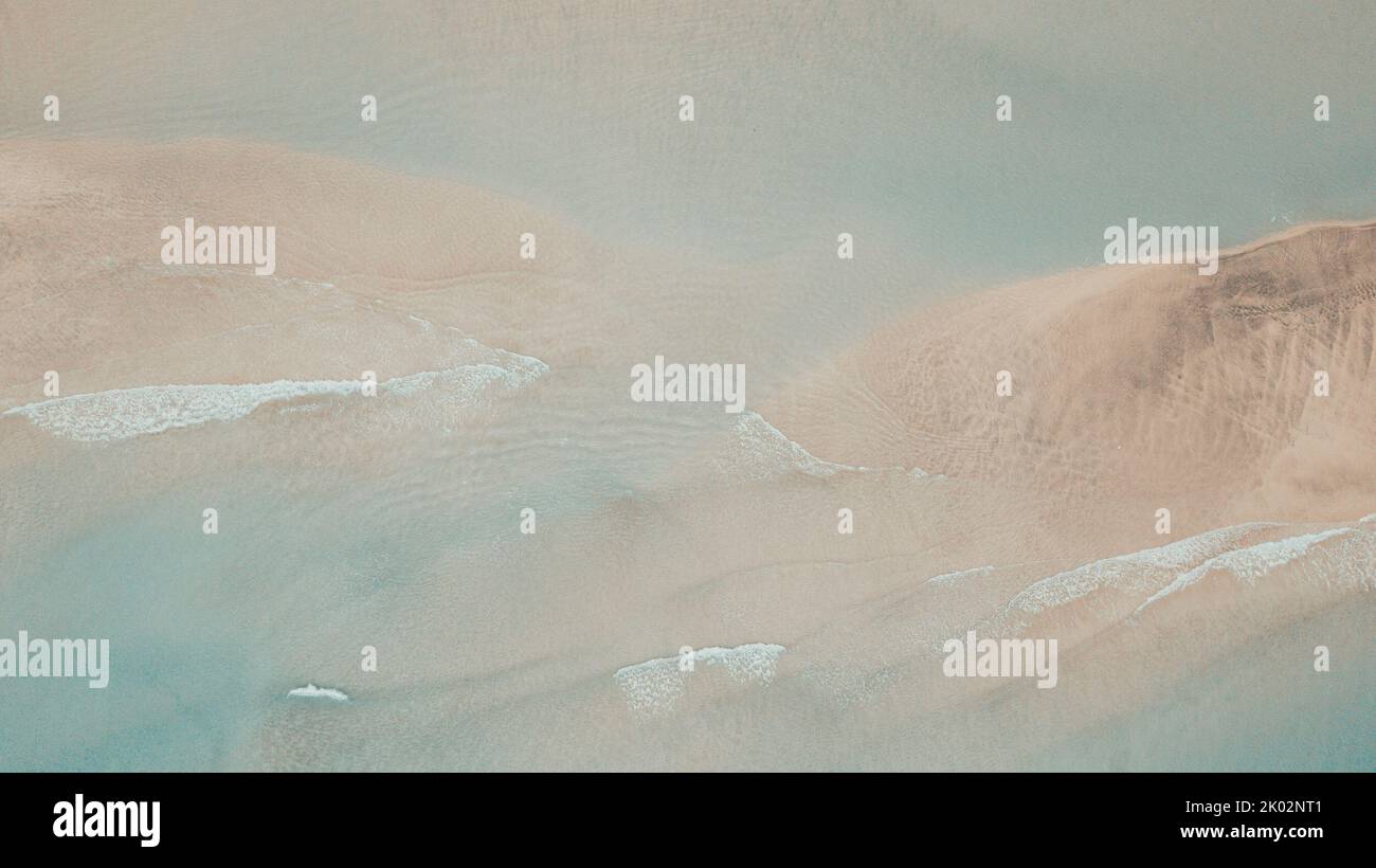 Vertical view of sand and beach with blue clean sea water. Tropical ...