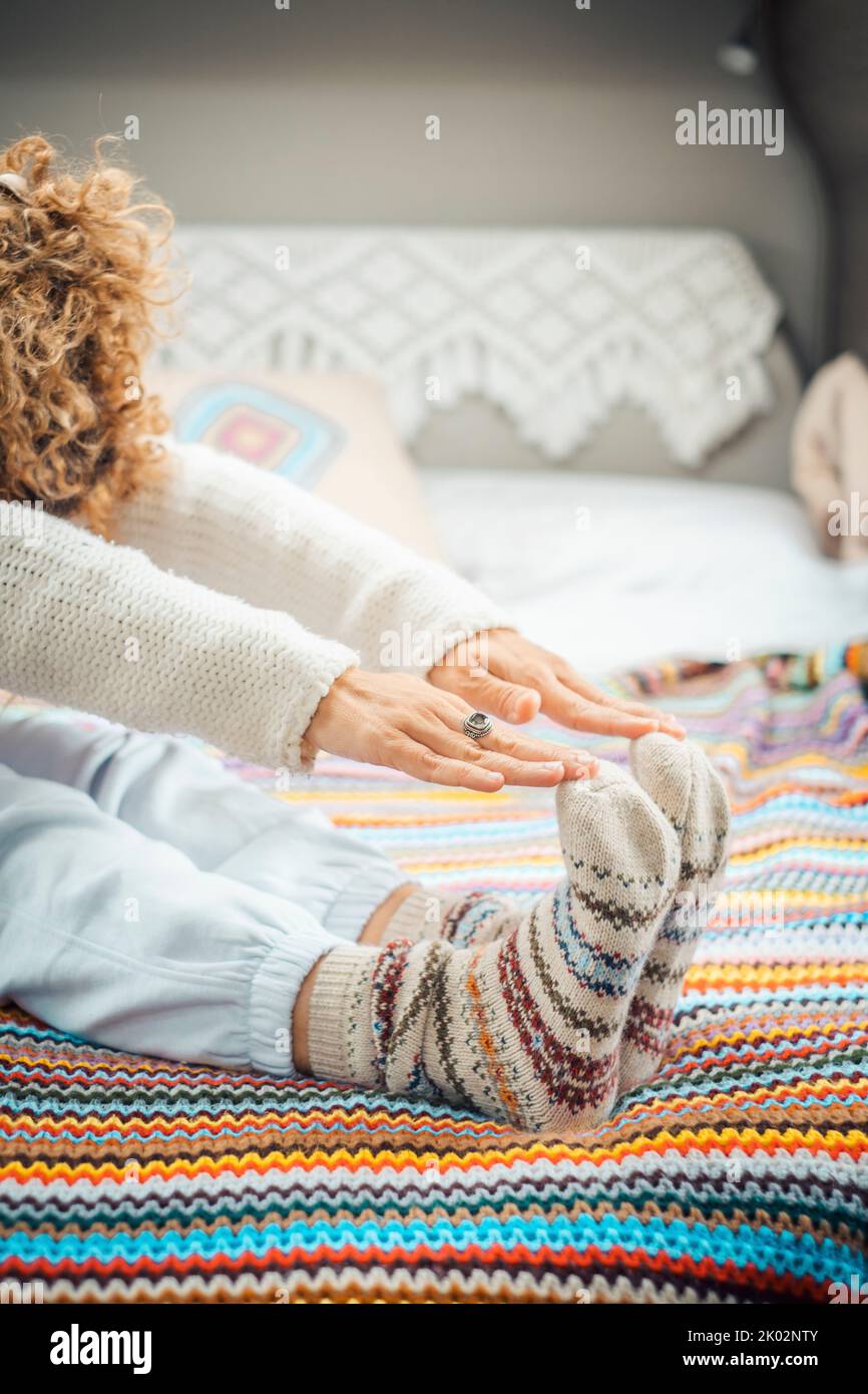 Adult woman doing sport healthy exercise inside camper van bedroom ...