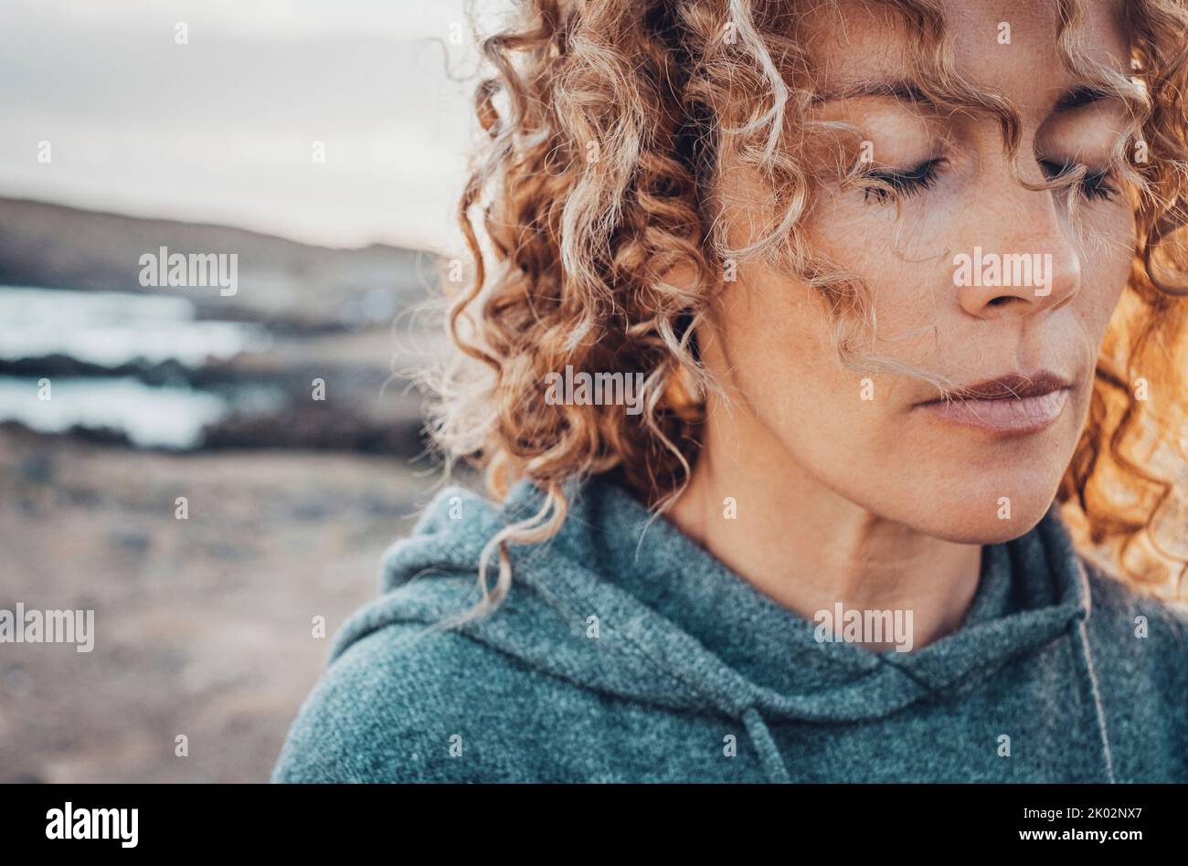Close up portrait of woman face with closed eyes. Feeling and ...