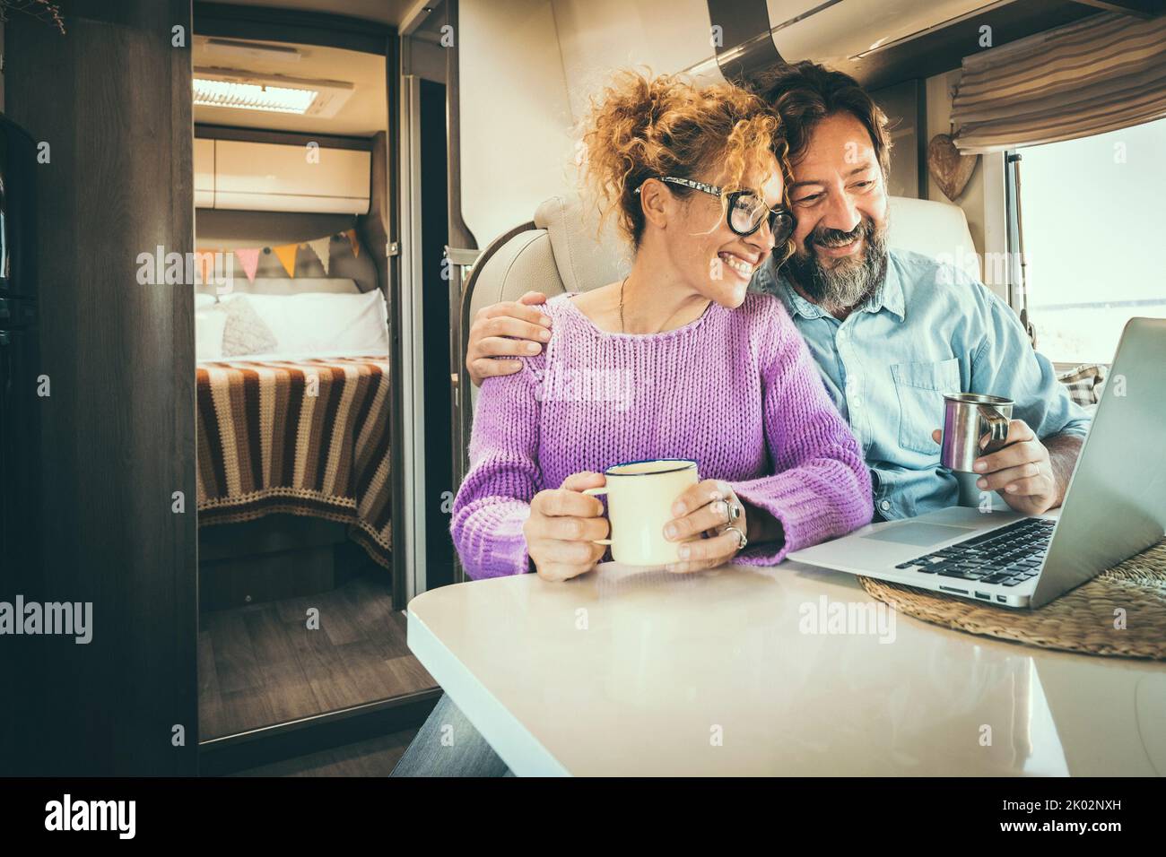 Camper van traveler enjoy and use laptop computer together inside ...