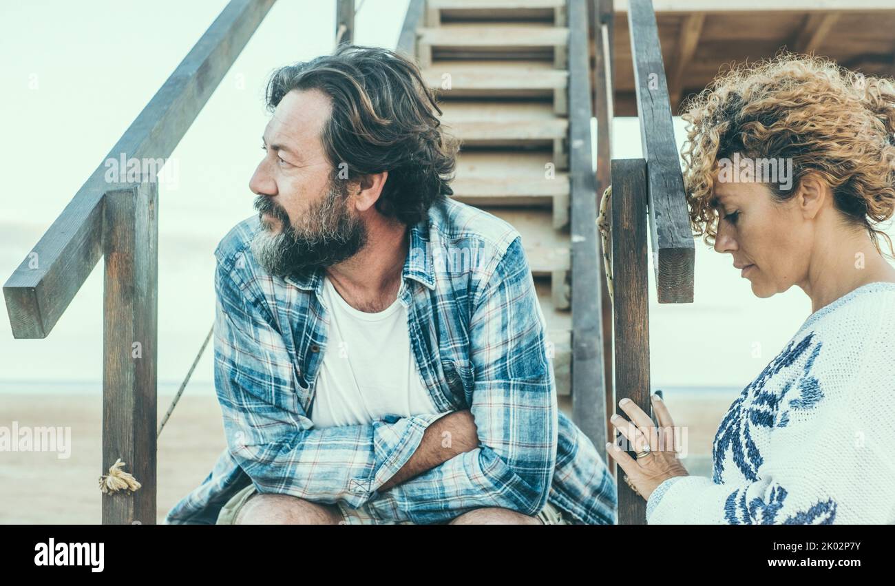 Relationship problems for adult couple. Man and woman sad and serious ...