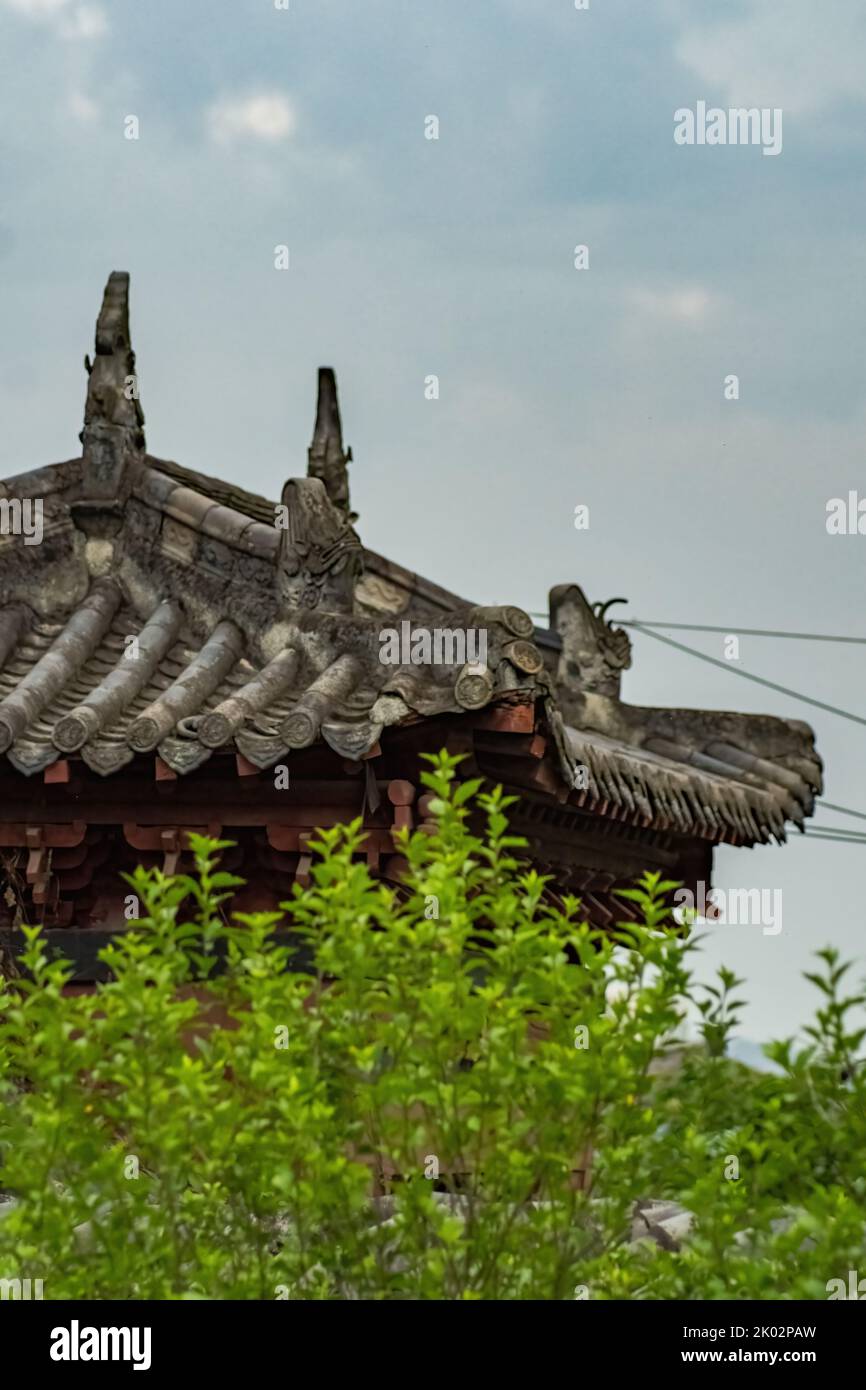 A vertical shot of a roof of an old Asian-style pavilion in Qinglonghu ...