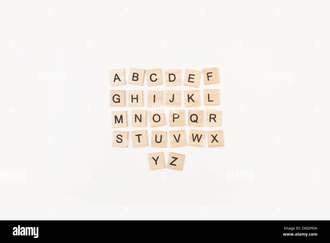 Wooden letter cubes in alphabetical order on a white background Stock ...
