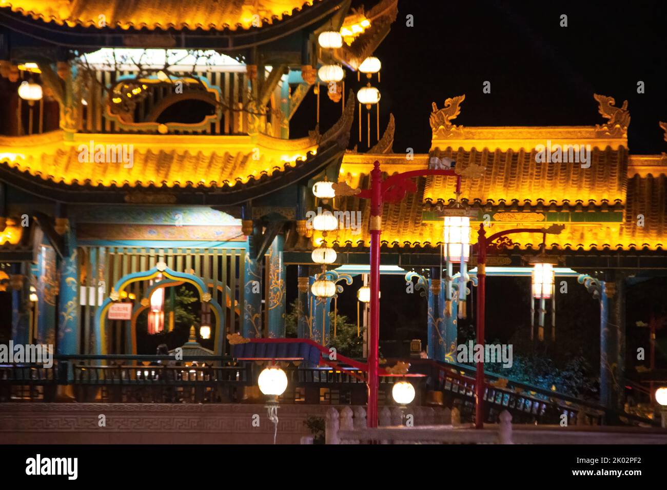 The illuminated buildings of the Impression Water street in Meishan ...