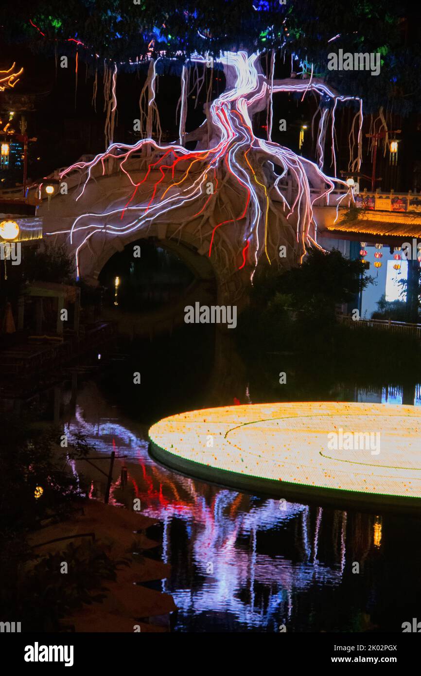 A vertical shot of the illuminated details of the Impression Water ...