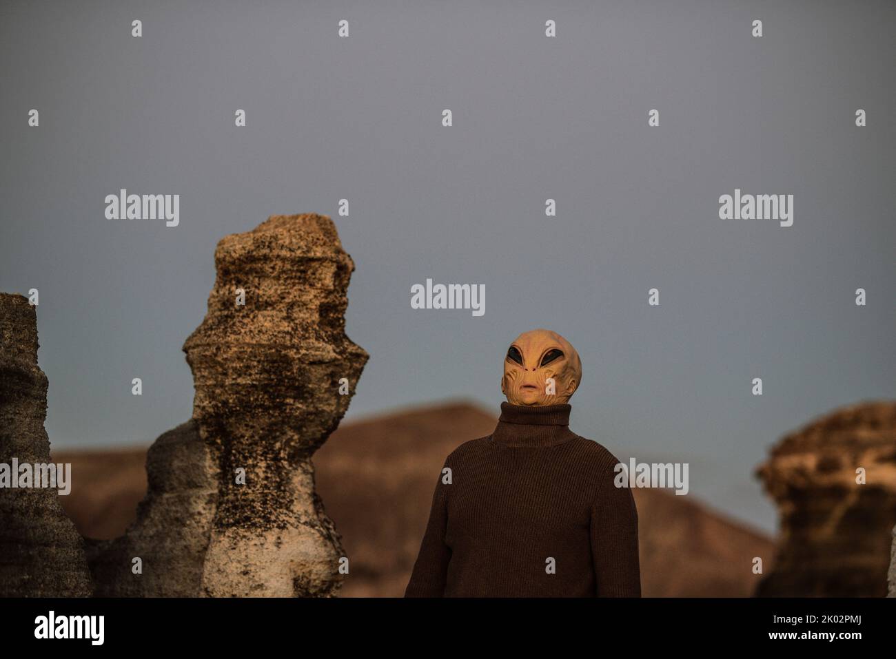 Alien ufo portrait with moon landscape in background. Standing ...
