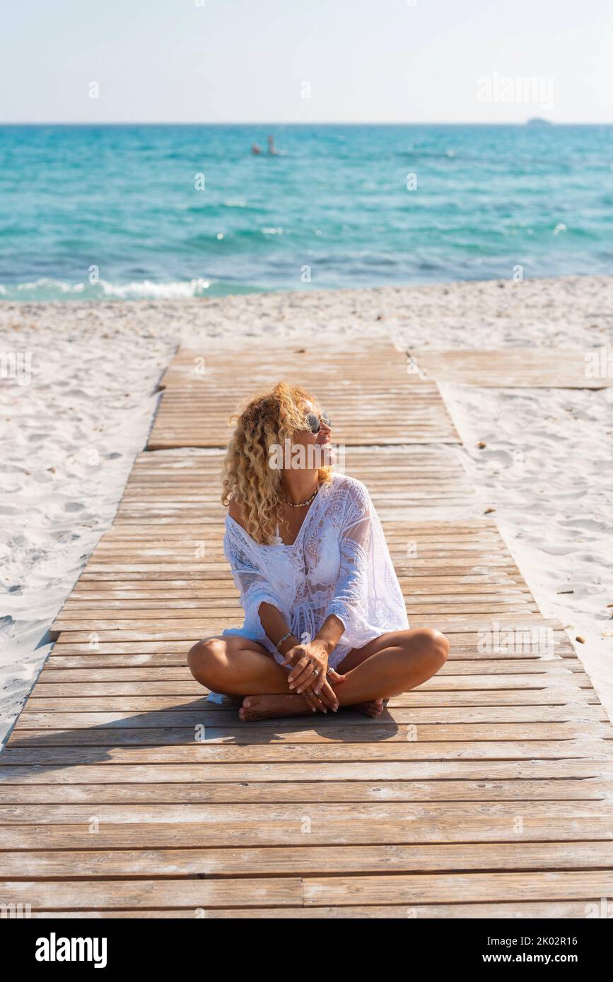 Pretty blonde beach in white hi-res stock photography and images - Alamy