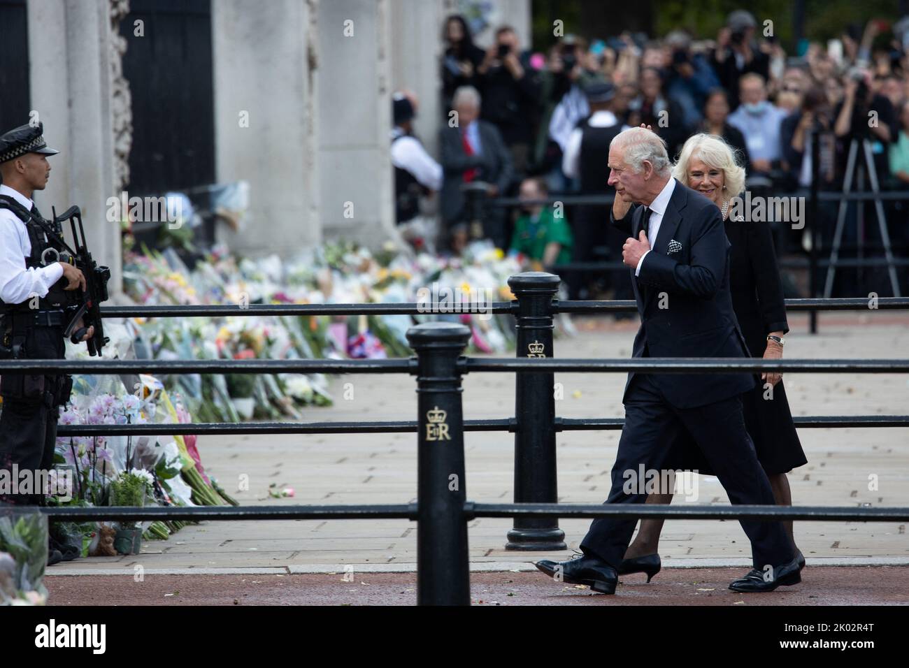 King Charles and Queen Camilla are cheered by the crowd as they walk ...
