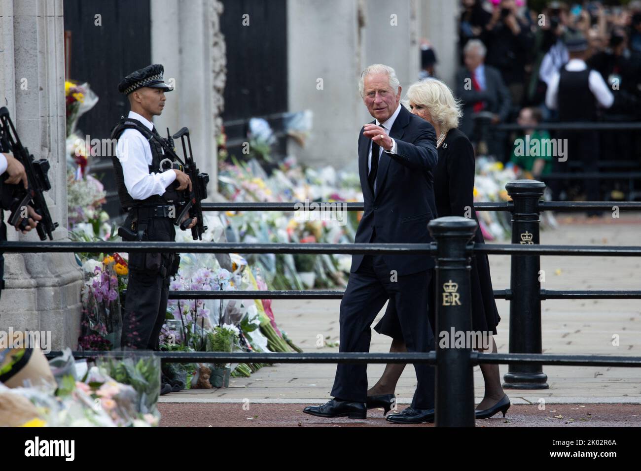 King Charles and Queen Camilla are cheered by the crowd as they walk ...